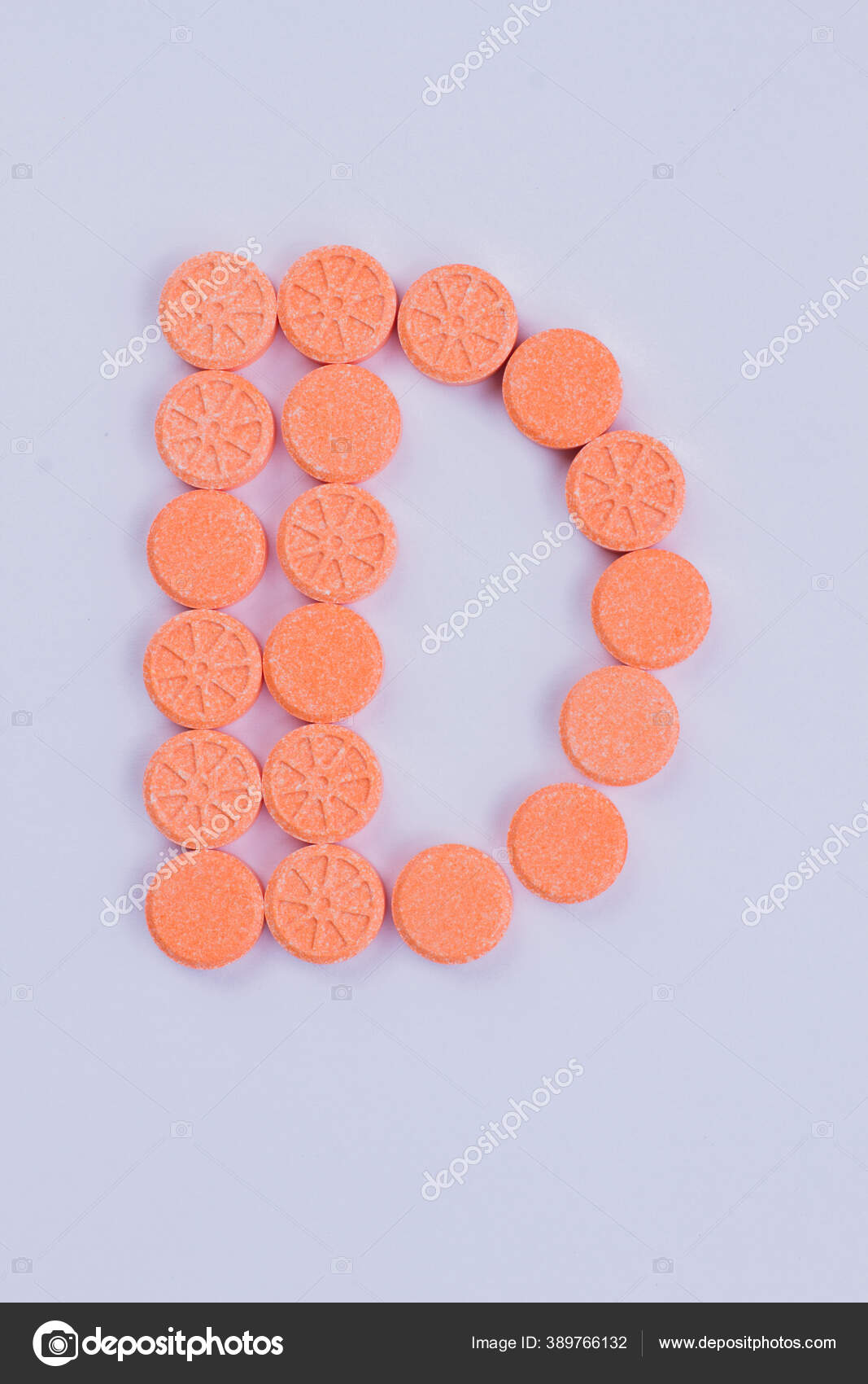 The letter D made of round pills. — Stock Photo © Denisfilm #389766132