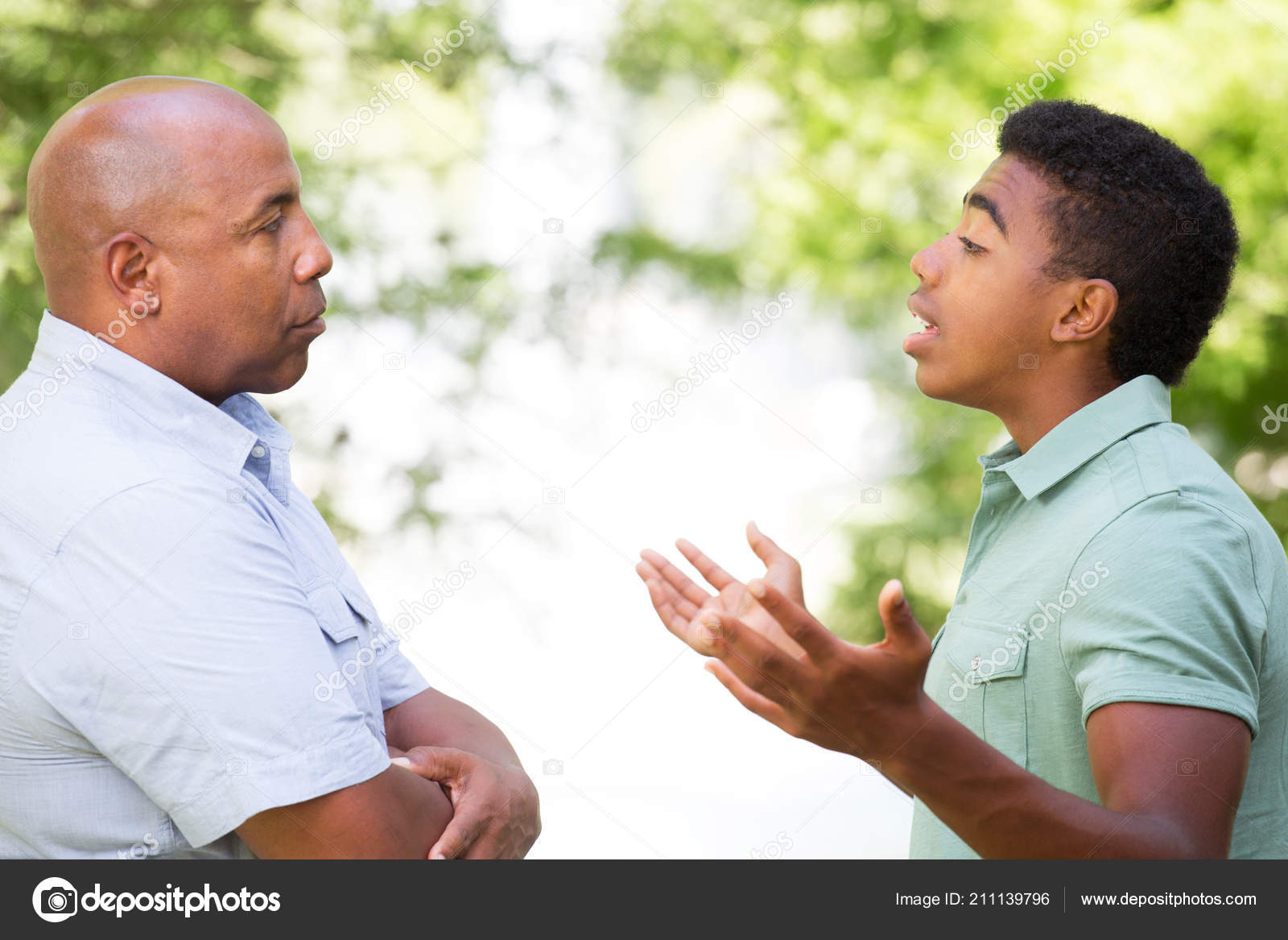 Father and son having a serious conversation. Stock Photo by ...