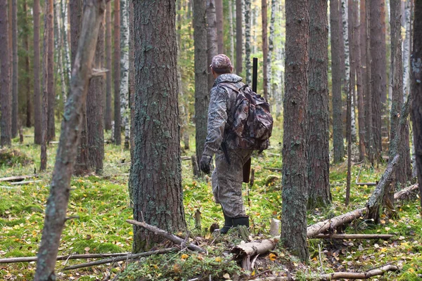 Hunter walking in the woods — Stock Photo © Scharfsinn #130357770