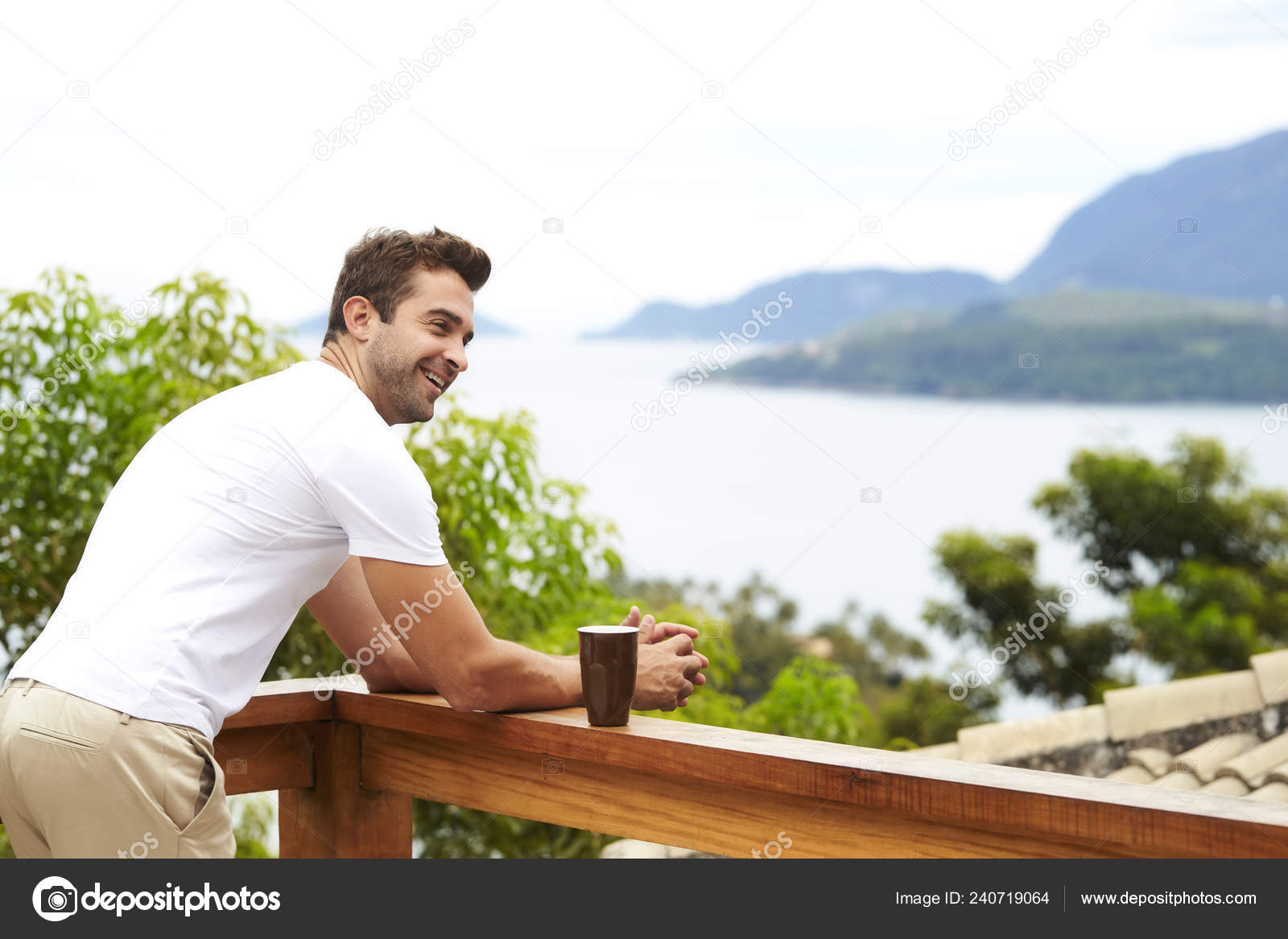 Smiling Guy Leaning Balcony Looking Away Stock Photo by ©sanneberg ...