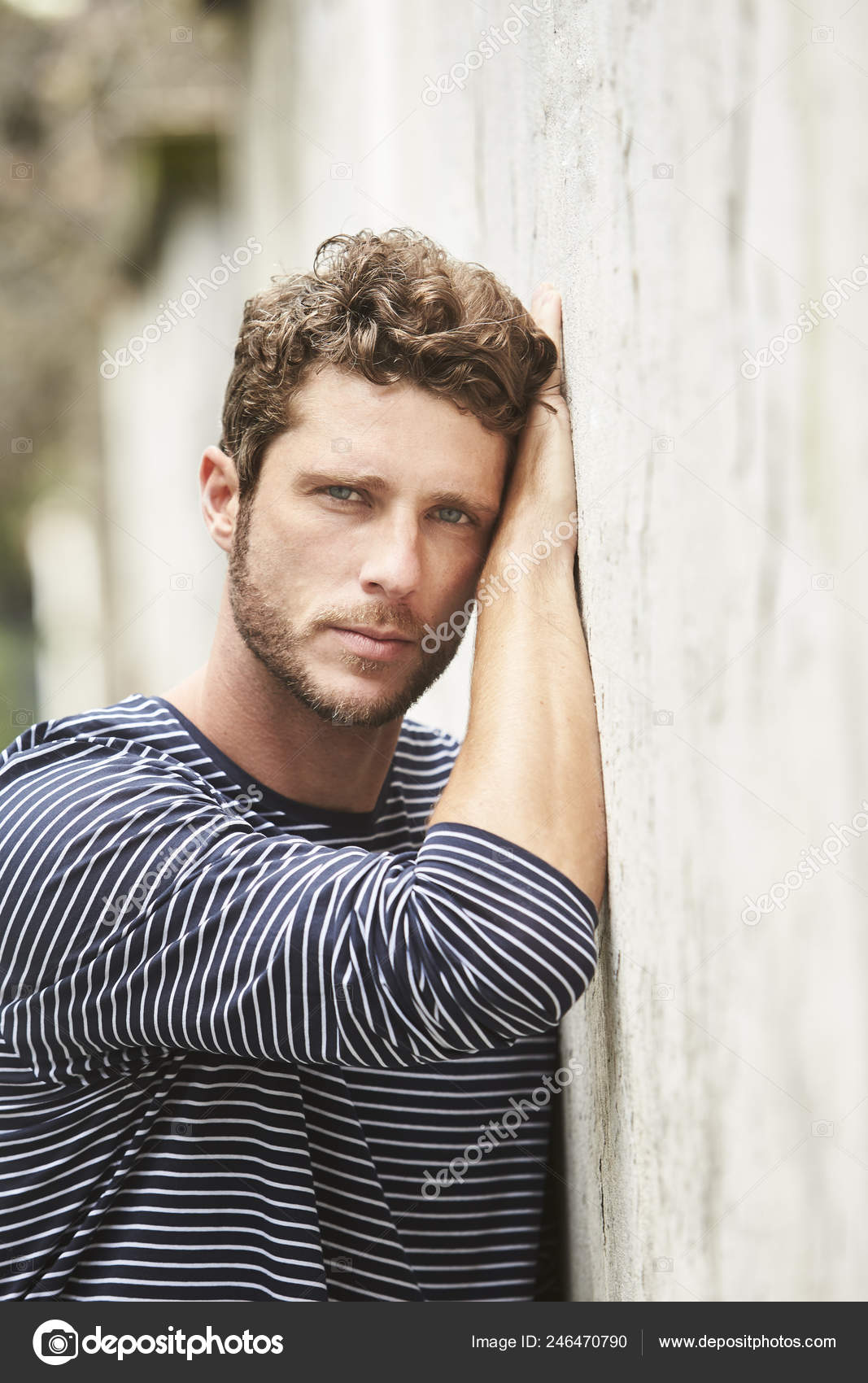 Young Guy Looking Serious Leaning Wall Stock Photo by ©sanneberg 246470790