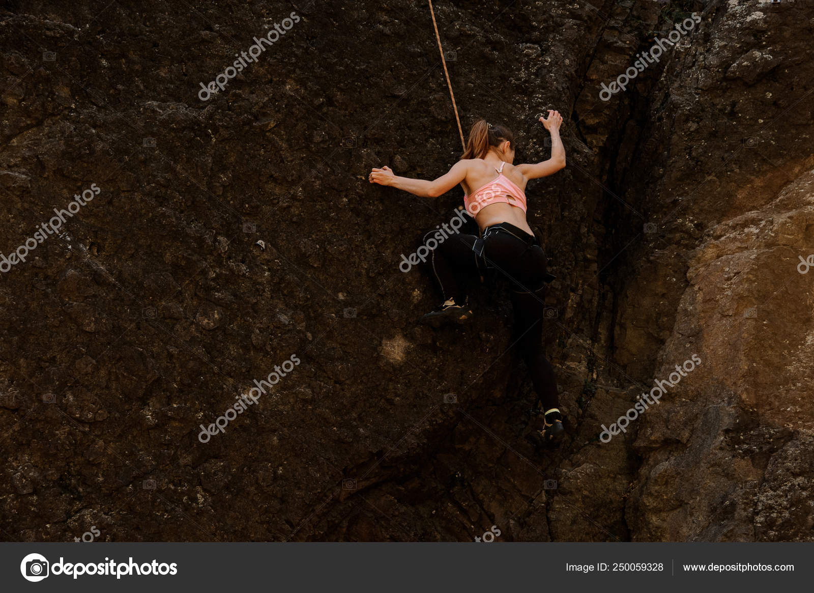 Woman equipped with a rope climbing on the rock — Stock Photo © Fesenko ...