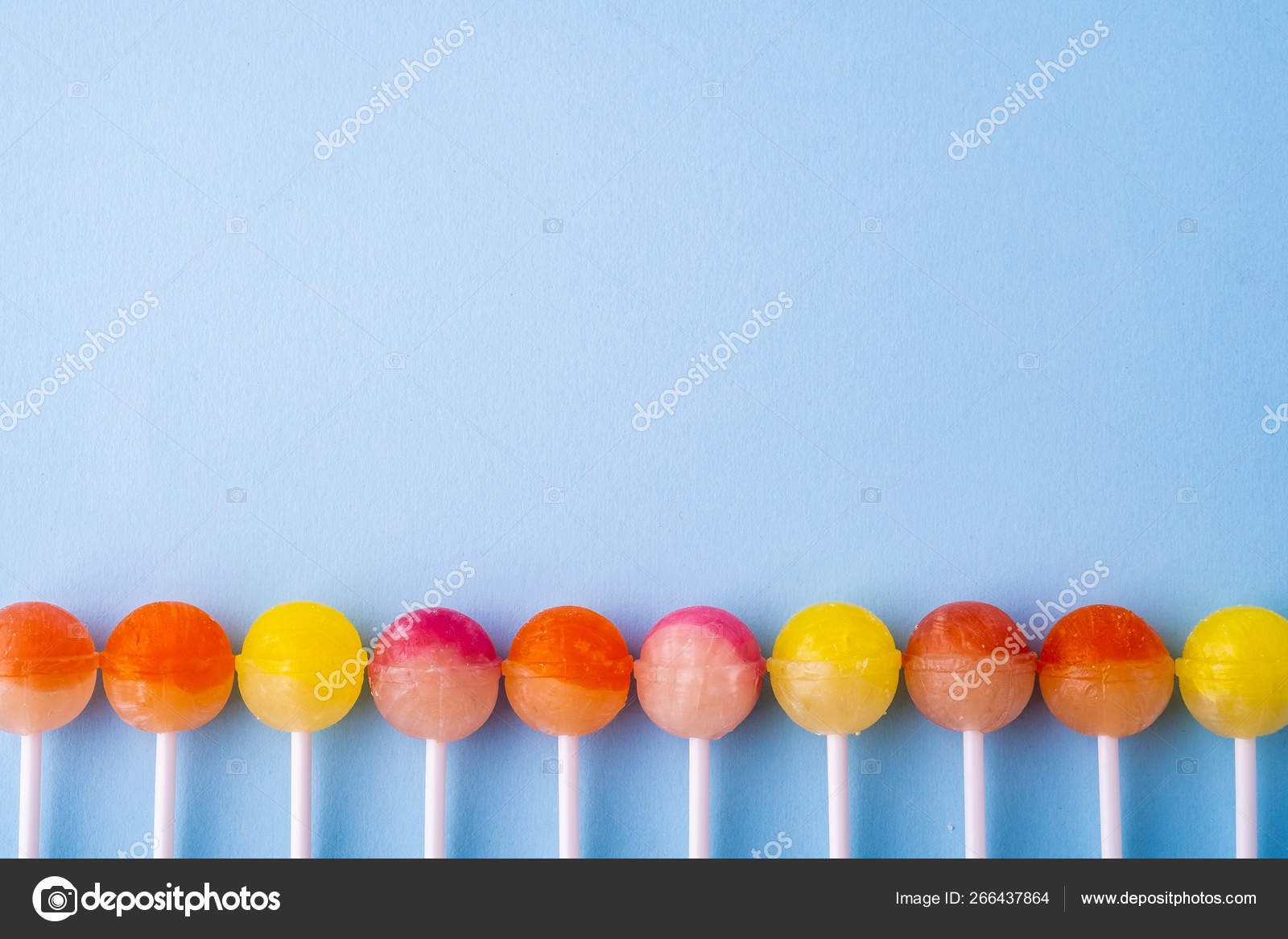 Lollipop Candies Row Blue Background Top View Stock Photo by ...