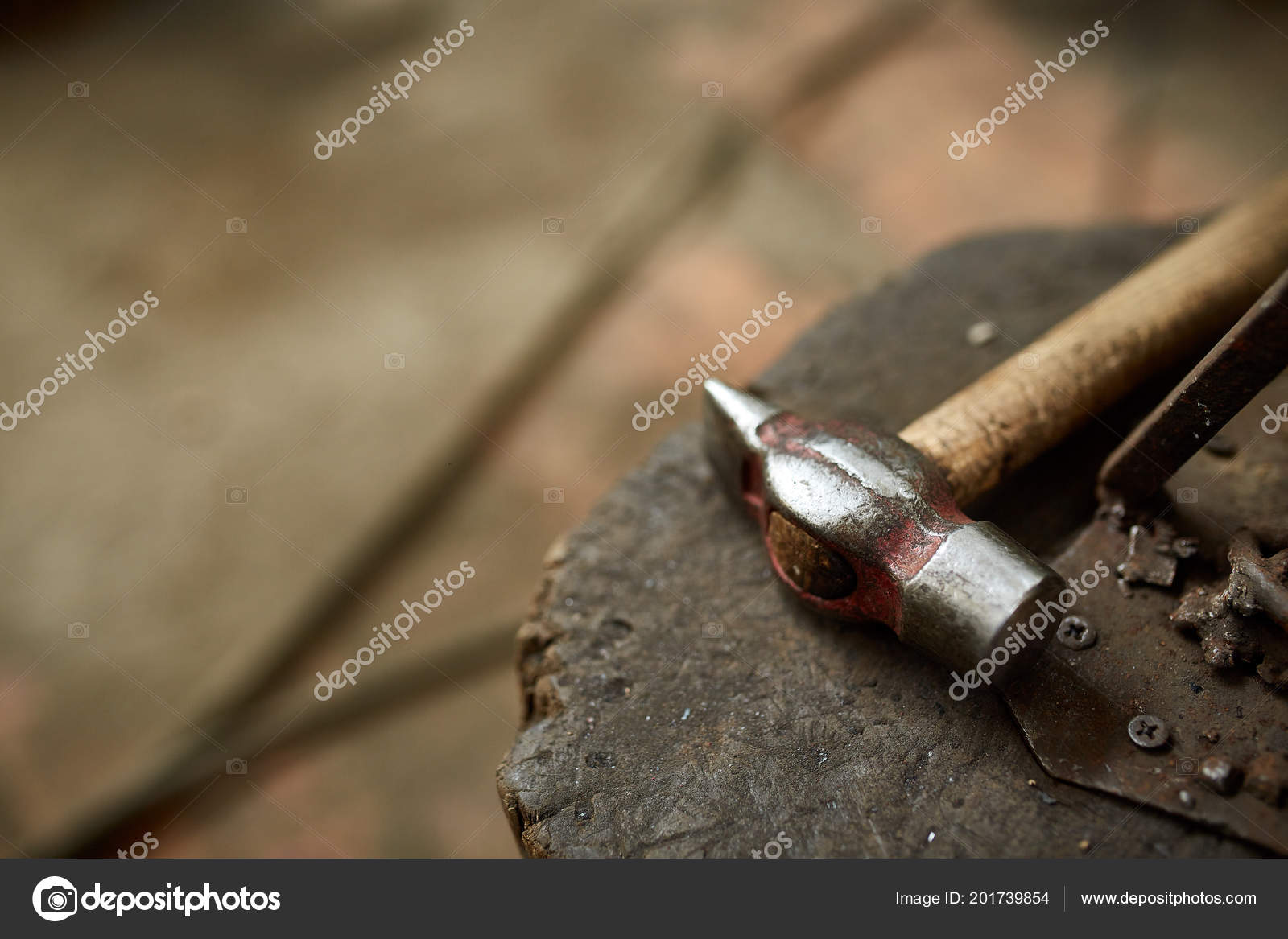 Working metal tools in blacksmiths workshop, close-up, selective focus ...