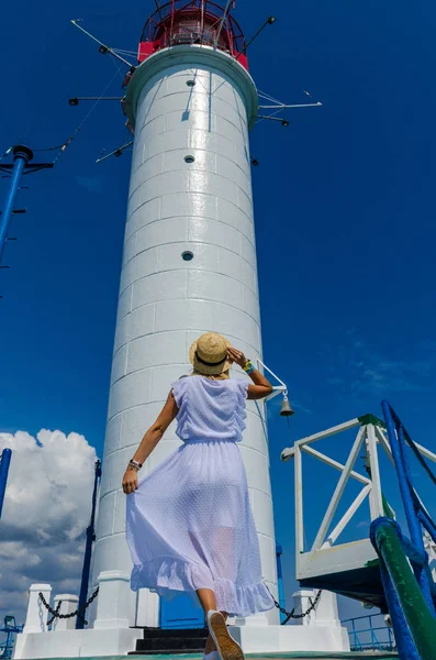 Girl by lighthouse Stock Photos, Royalty Free Girl by lighthouse Images ...