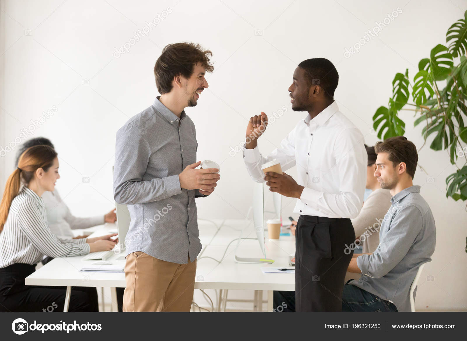 Friendly Multiracial Young Colleagues Chatting Together Office Coffee ... Friendly Multiracial Young Colleagues Chatting Together Office Coffee ...