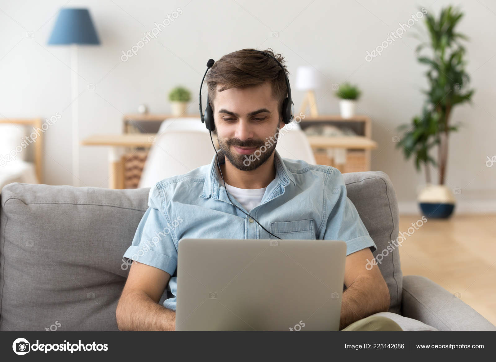 Man using headset and laptop working studying at home — Stock Photo © fizkes #223142086