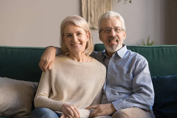 Happy old senior retired family couple bonding posing for portrait ...