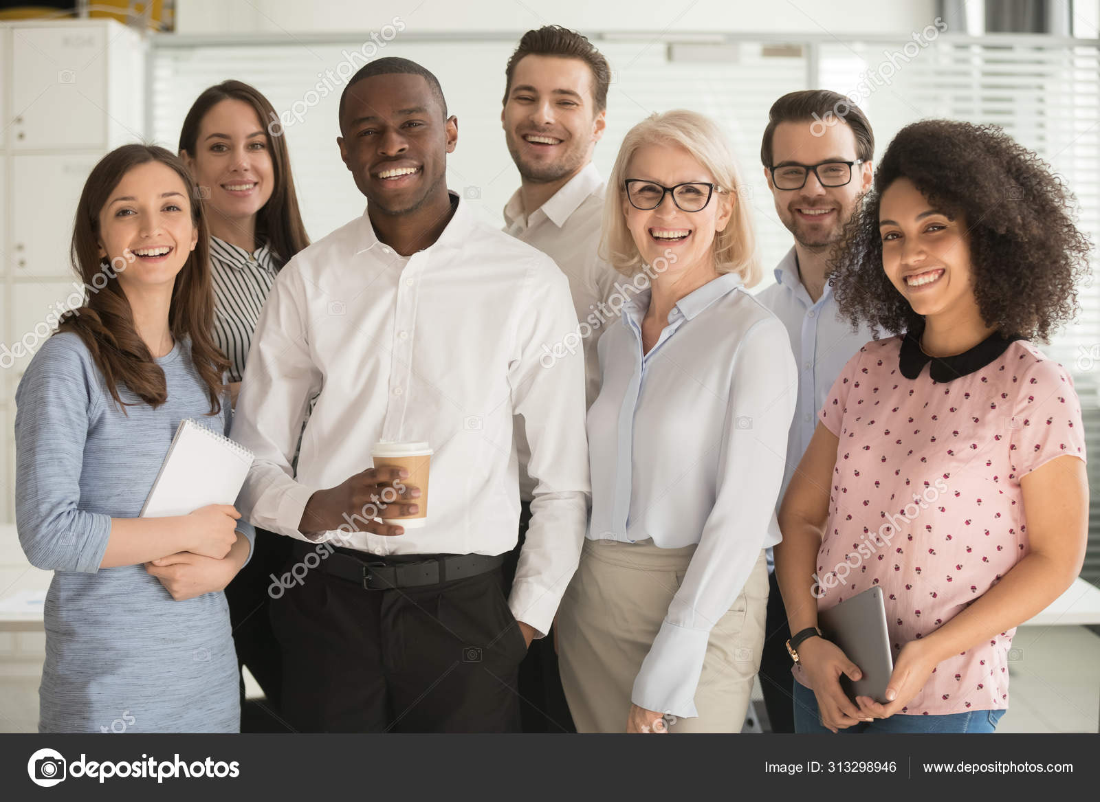 Positive multi racial corporate team posing looking at camera — Stock ...