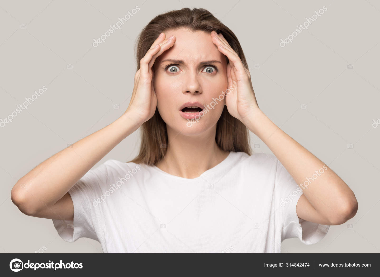 Stunned millennial woman look at camera shocked by bad news — Stock ...