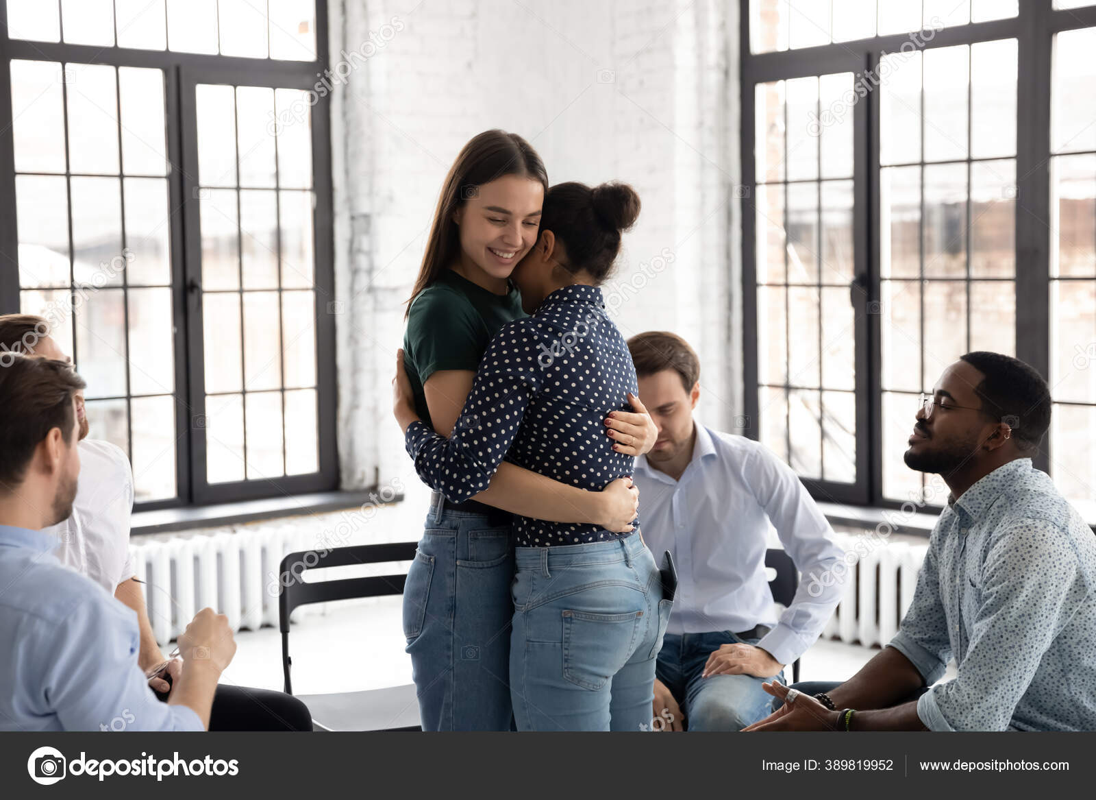 Girls hugging during team building activity or group therapy session ...