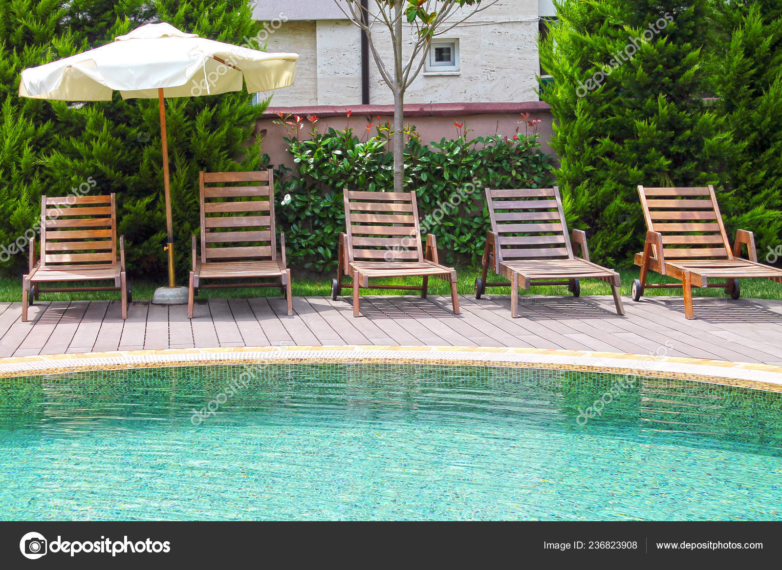 Swimming Pool Lounges Parasol Stock Photo by ©st-design 236823908