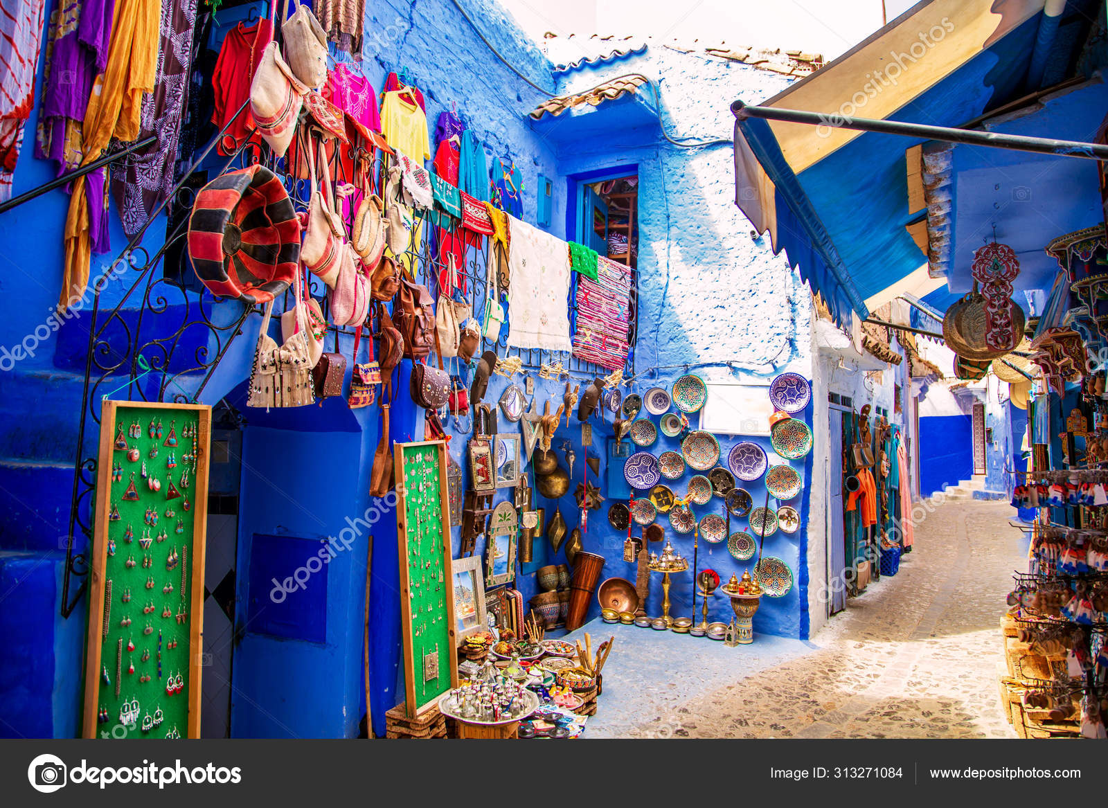 Traditional carpets on the blue Chefchaouen street. Stock Photo by ...