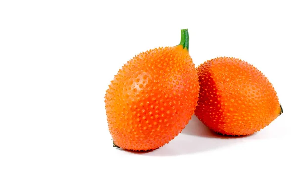 Gac fruit, typical of orange-colored plant foods in Asia isolate ⬇ ...