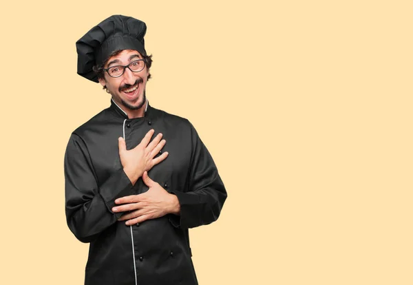 young crazy man as a chef Laughing out loud with head tilted backwards ...