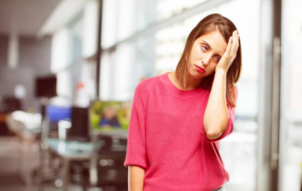 young woman full body. looking unenthusiastic and bored, listening to ...
