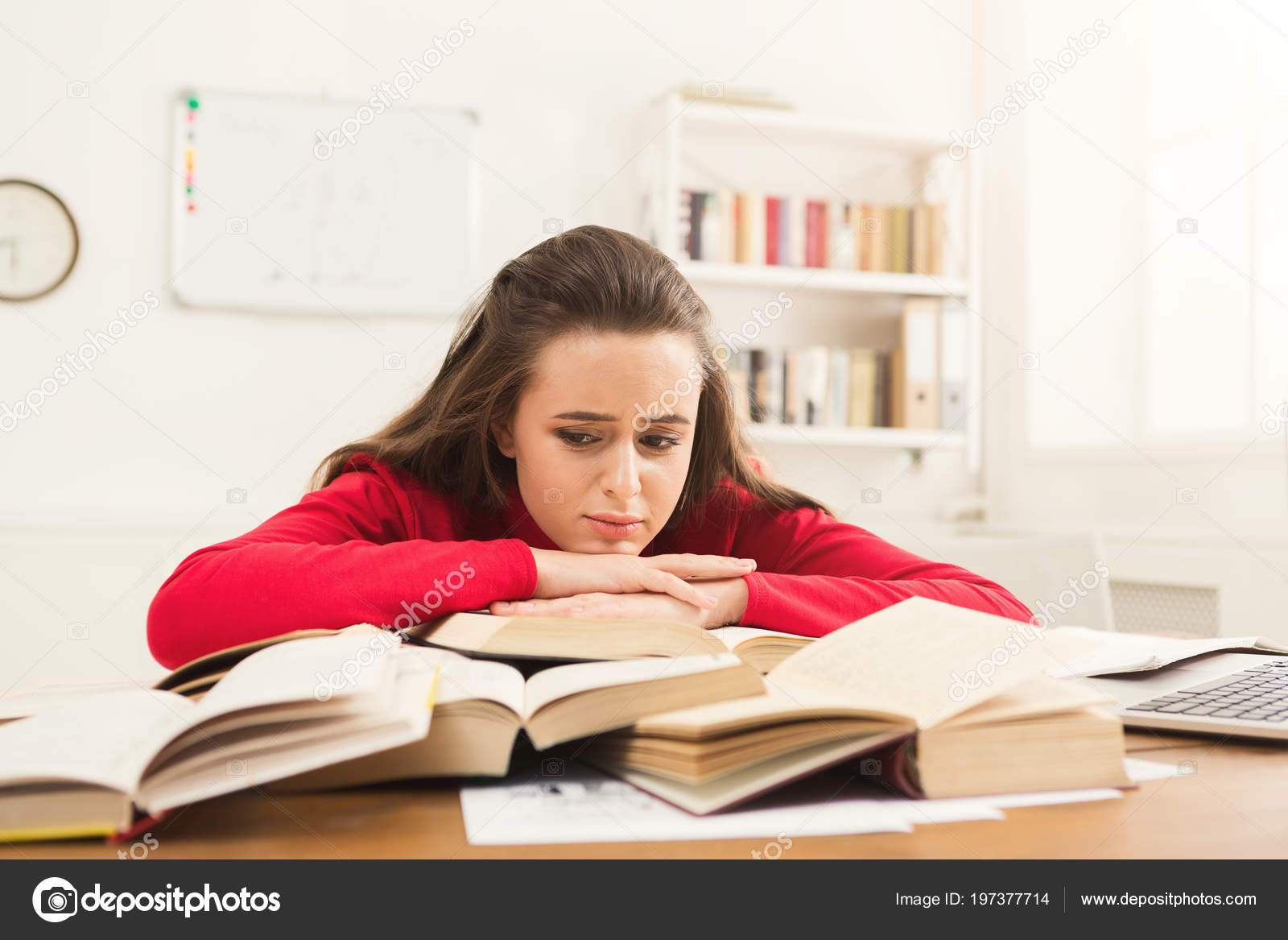 Student girl studying at table full of books Stock Photo by ©Milkos ...