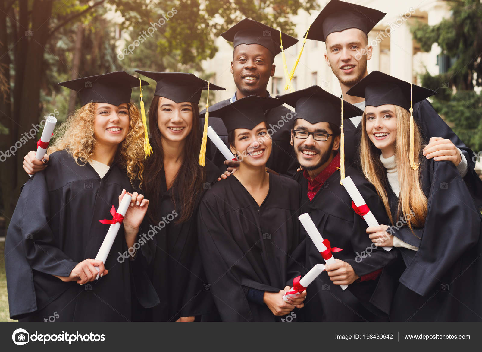 Group of students taking photo on graduation day — Stock Photo © Milkos ...