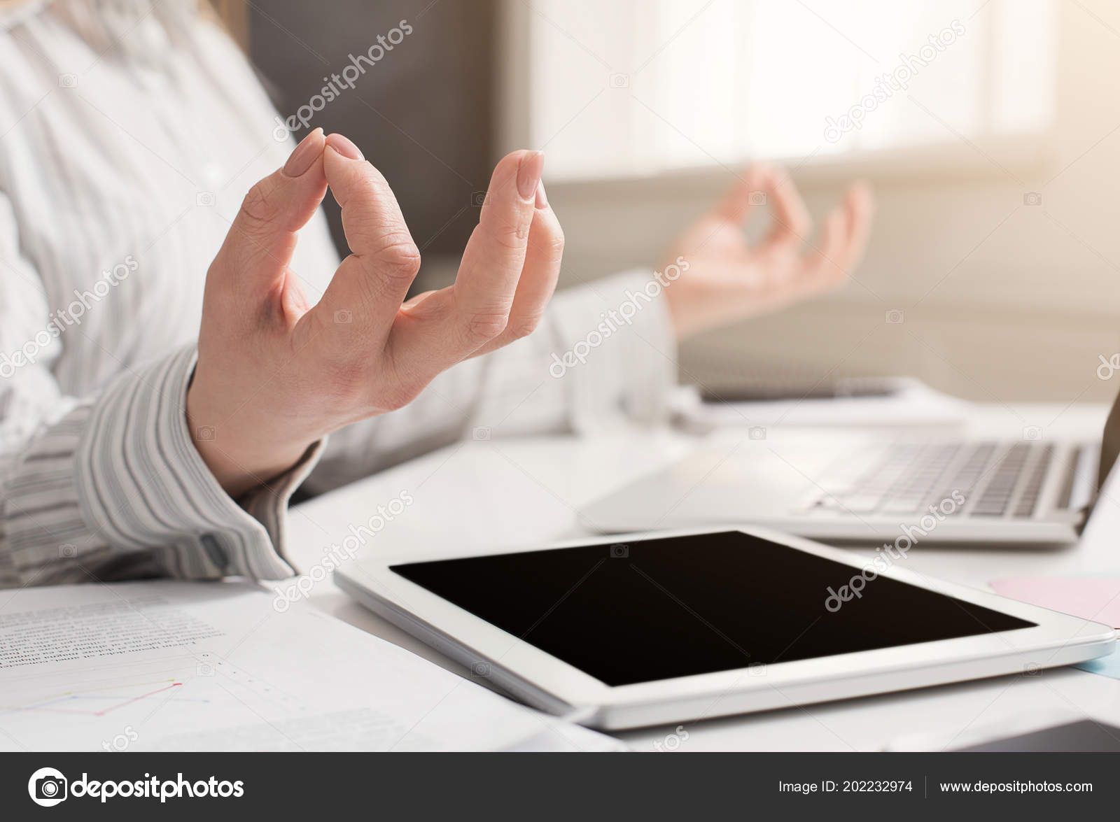 Woman meditating while working on laptop and digital tablet — Stock ...