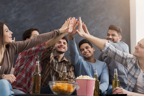 Multiracial friends giving high five while having party at home - Stock ...