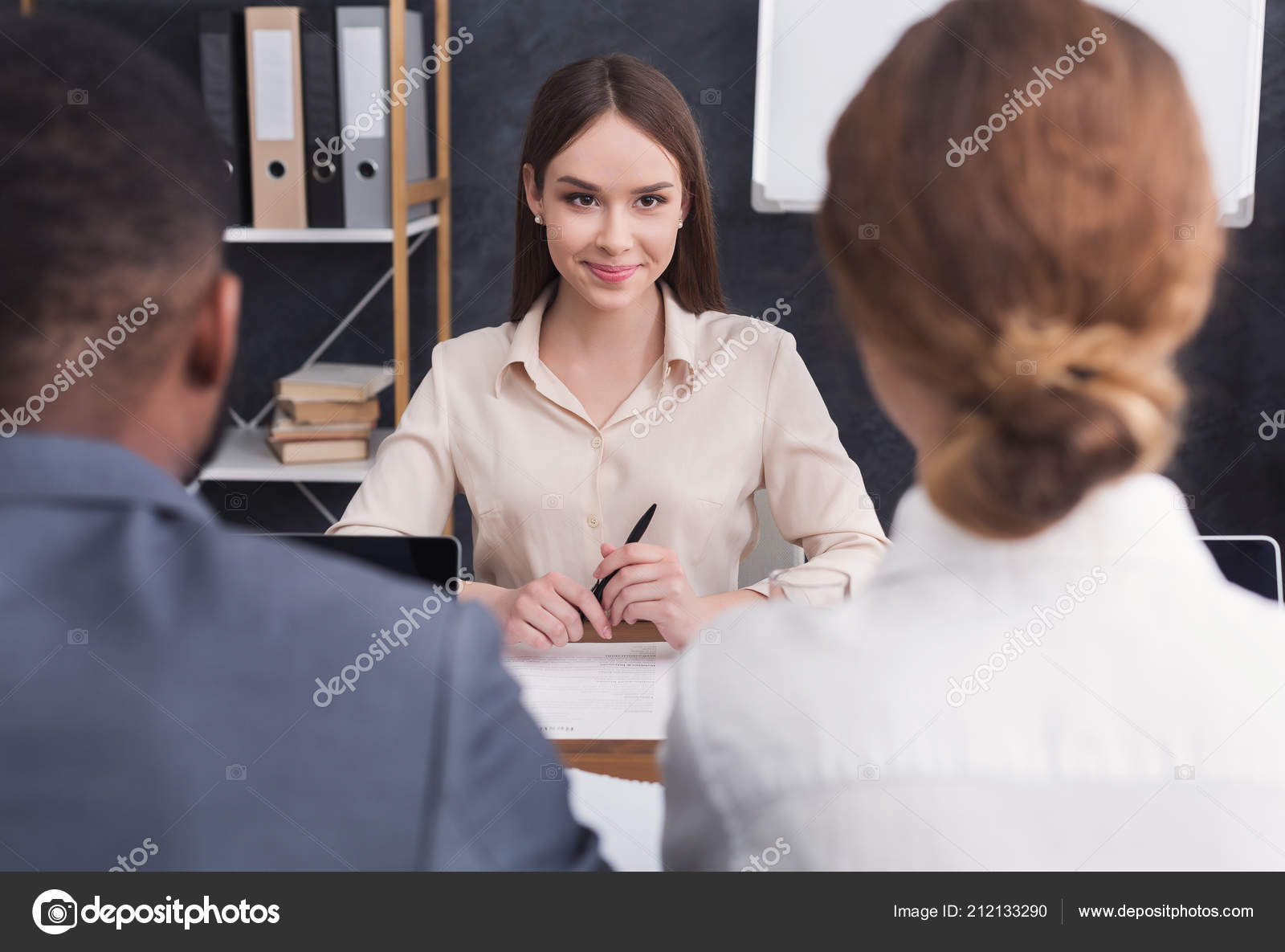 Young woman interviewing by two business people — Stock Photo © Milkos ...