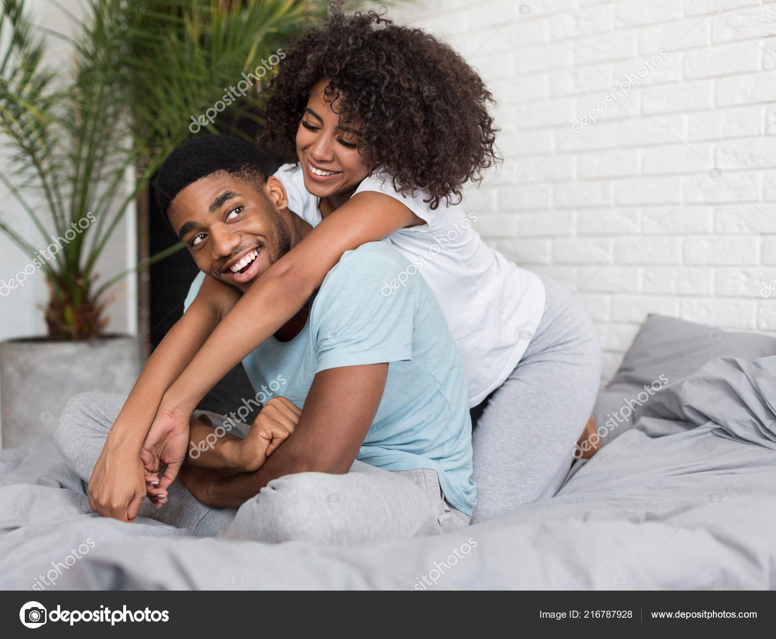 Loving young black couple embracing in bed — Stock Photo © Milkos ... Loving young black couple embracing in bed — Stock Photo © Milkos ...