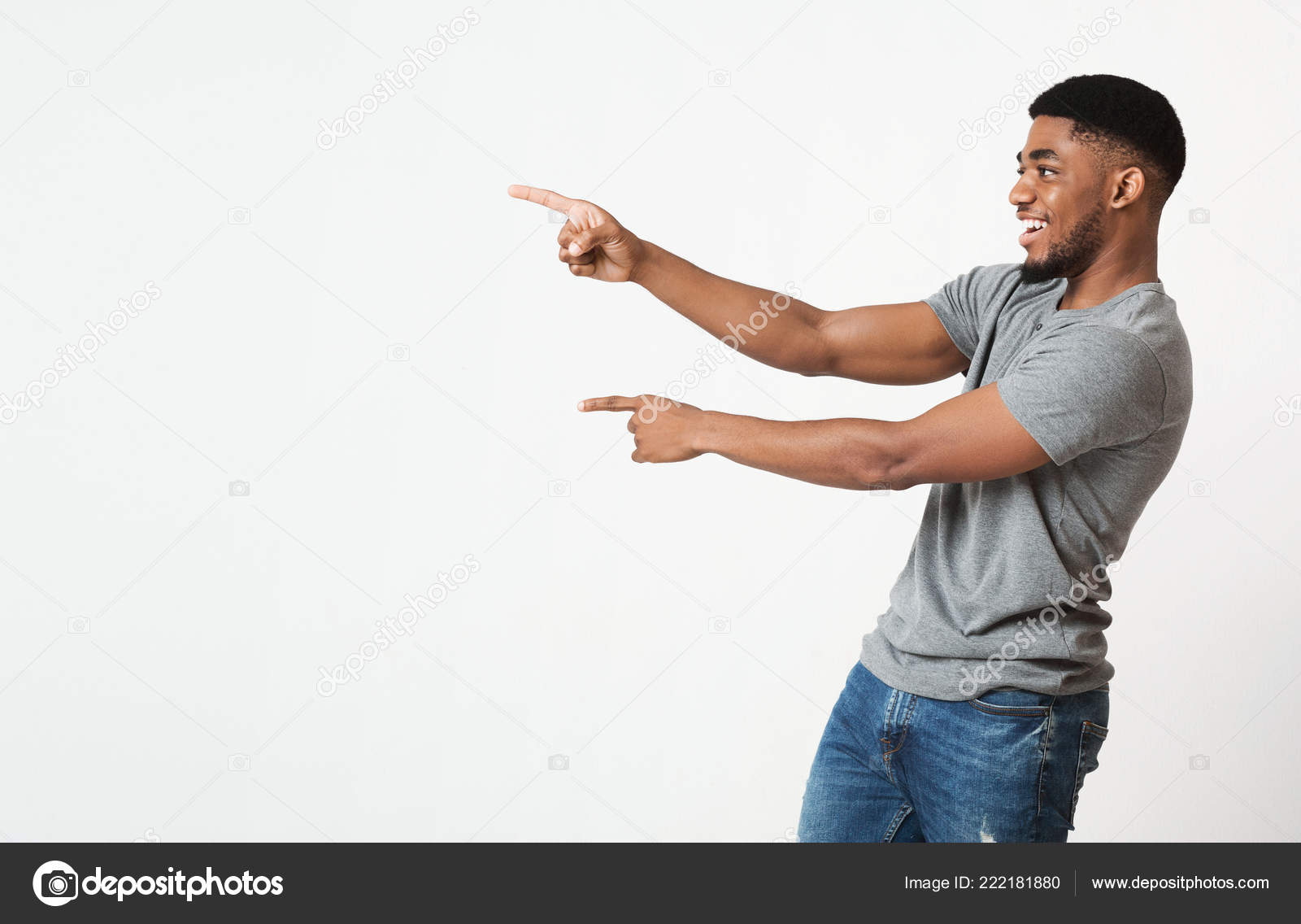 Excited black man pointing two fingers aside at copy space Stock Photo ...