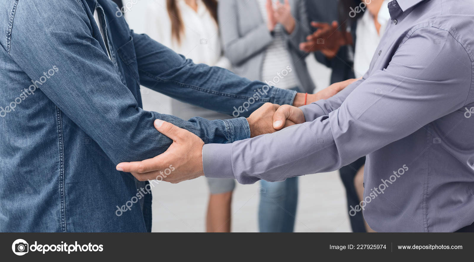 Business partners handshaking after striking deal in office ⬇ Stock ...