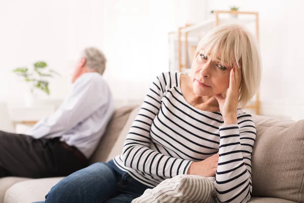 Senior Couple Having Relationship Problems, Looking To Opposite Sides ...