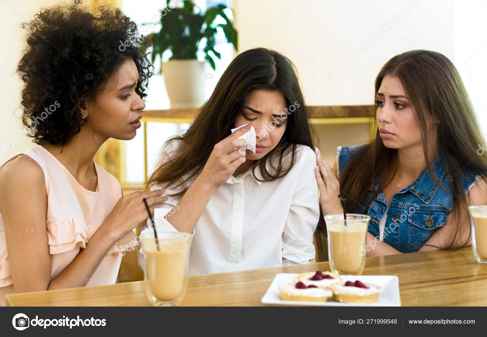 Two friends cheering up young depressed girl — Stock Photo © Milkos ...