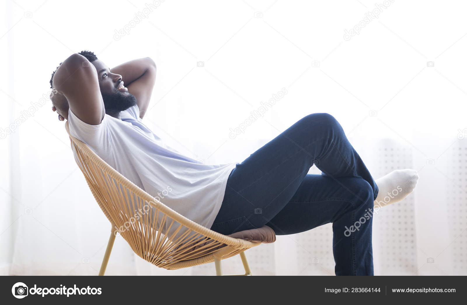 Millennial african american guy relaxing at home Stock Photo by ©Milkos ...