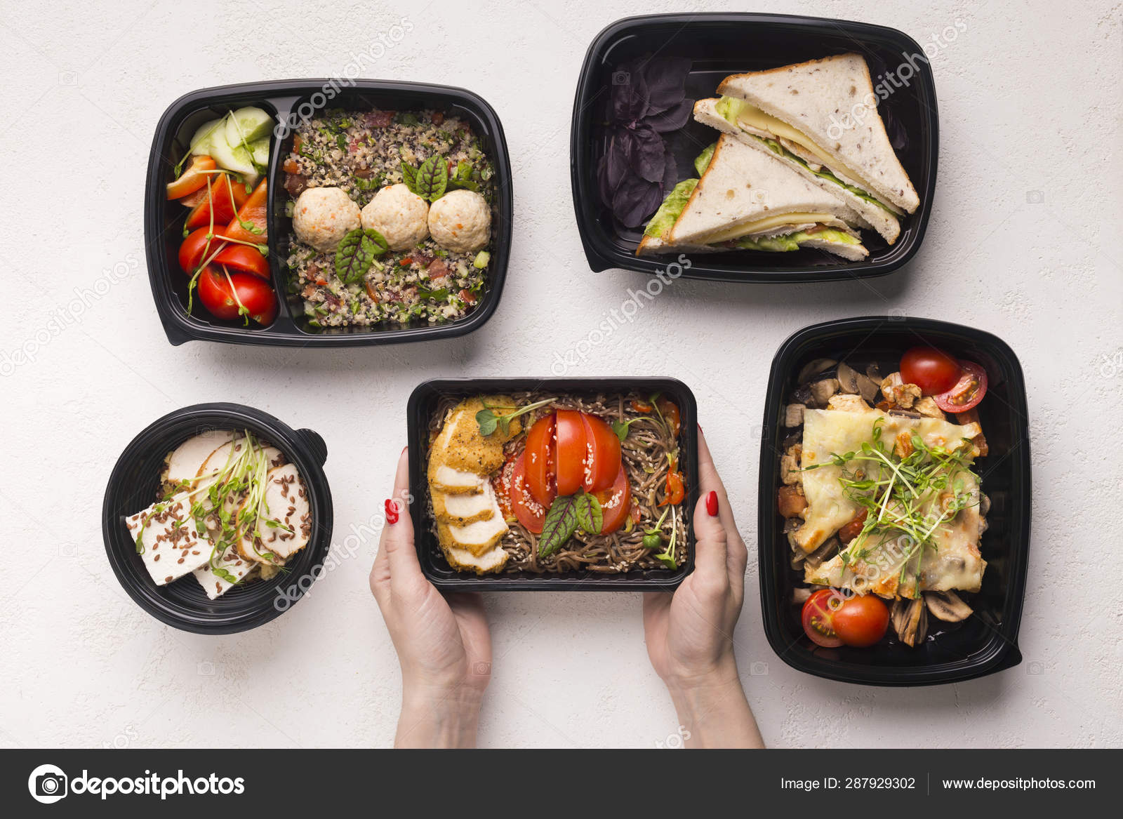 Tasty food in different boxes for day ration in woman hands Stock Photo ...