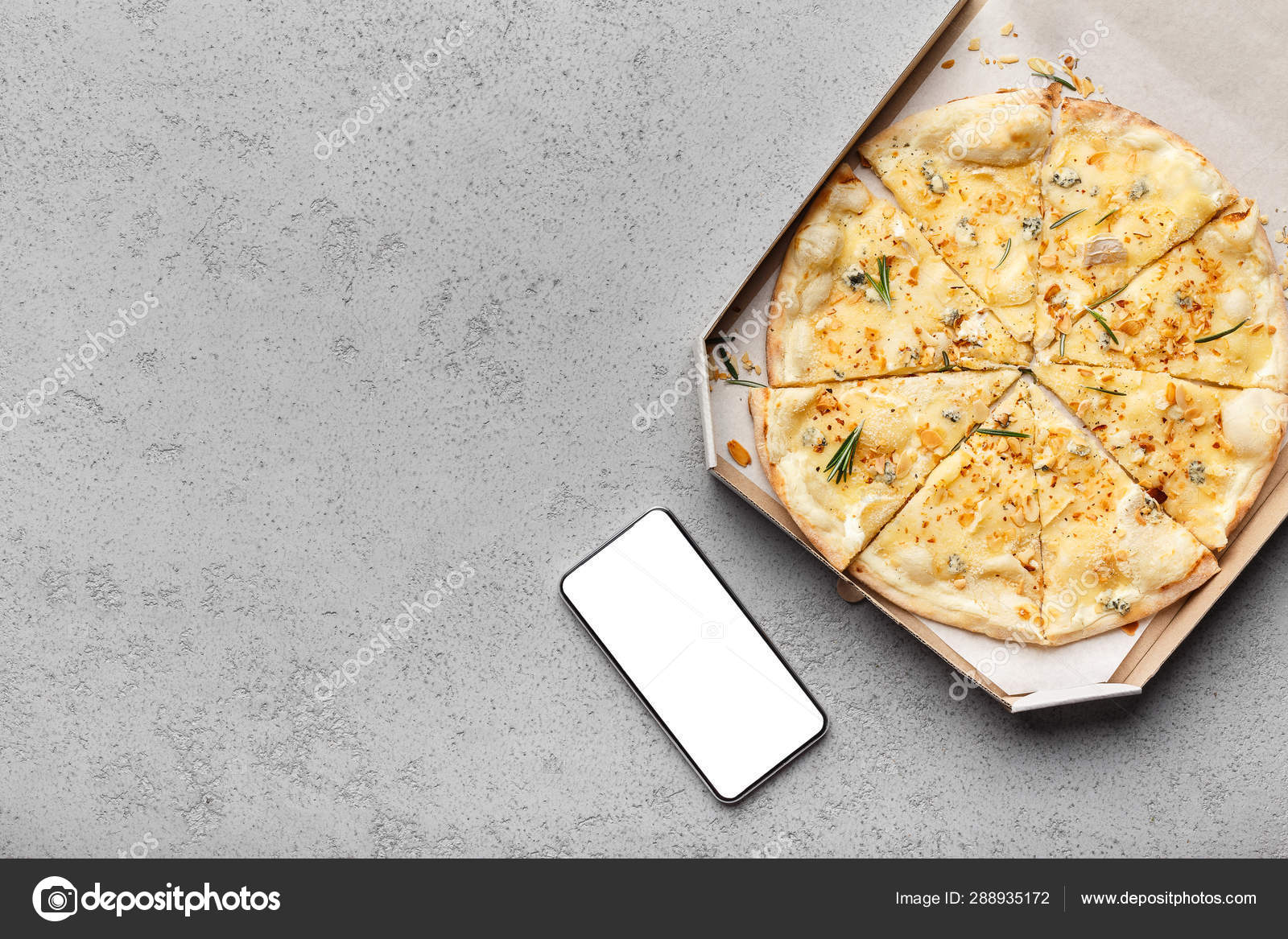 Cheesy pizza in delivery box and smartphone with blank screen — Stock ...