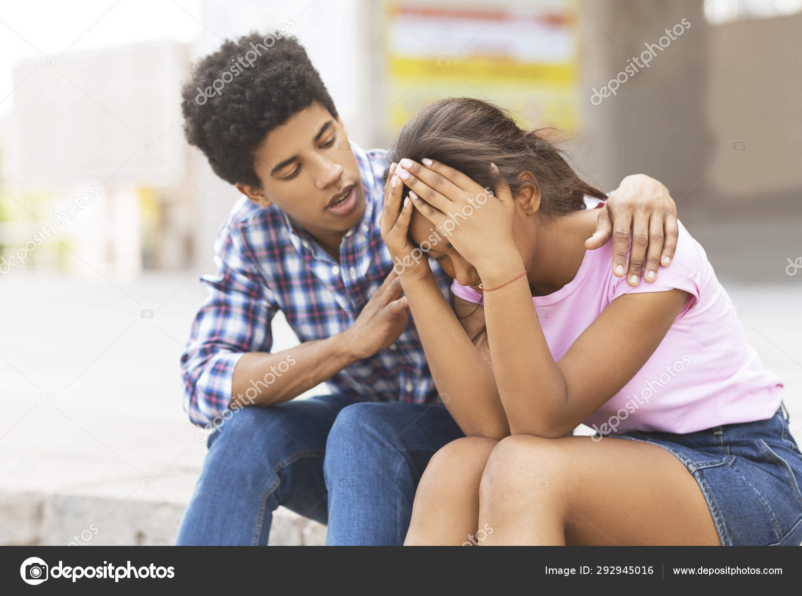 Young guy comforting his sad girlfriend that crying on public Stock ...