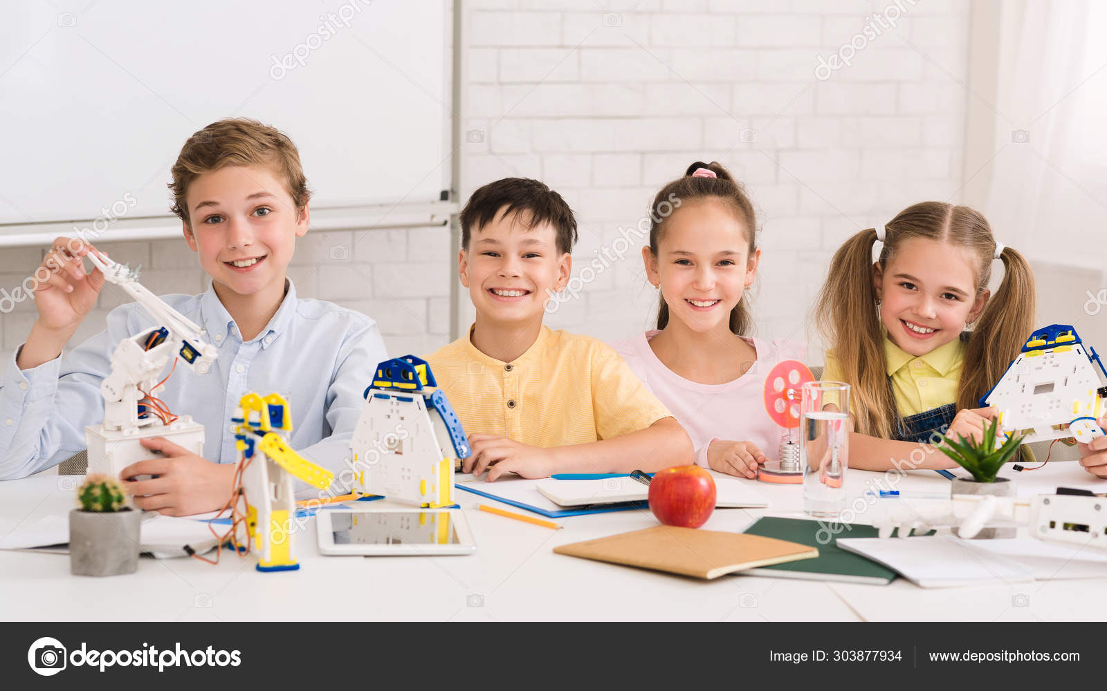 Stem education. Children creating robots at classroom Stock Photo by ...