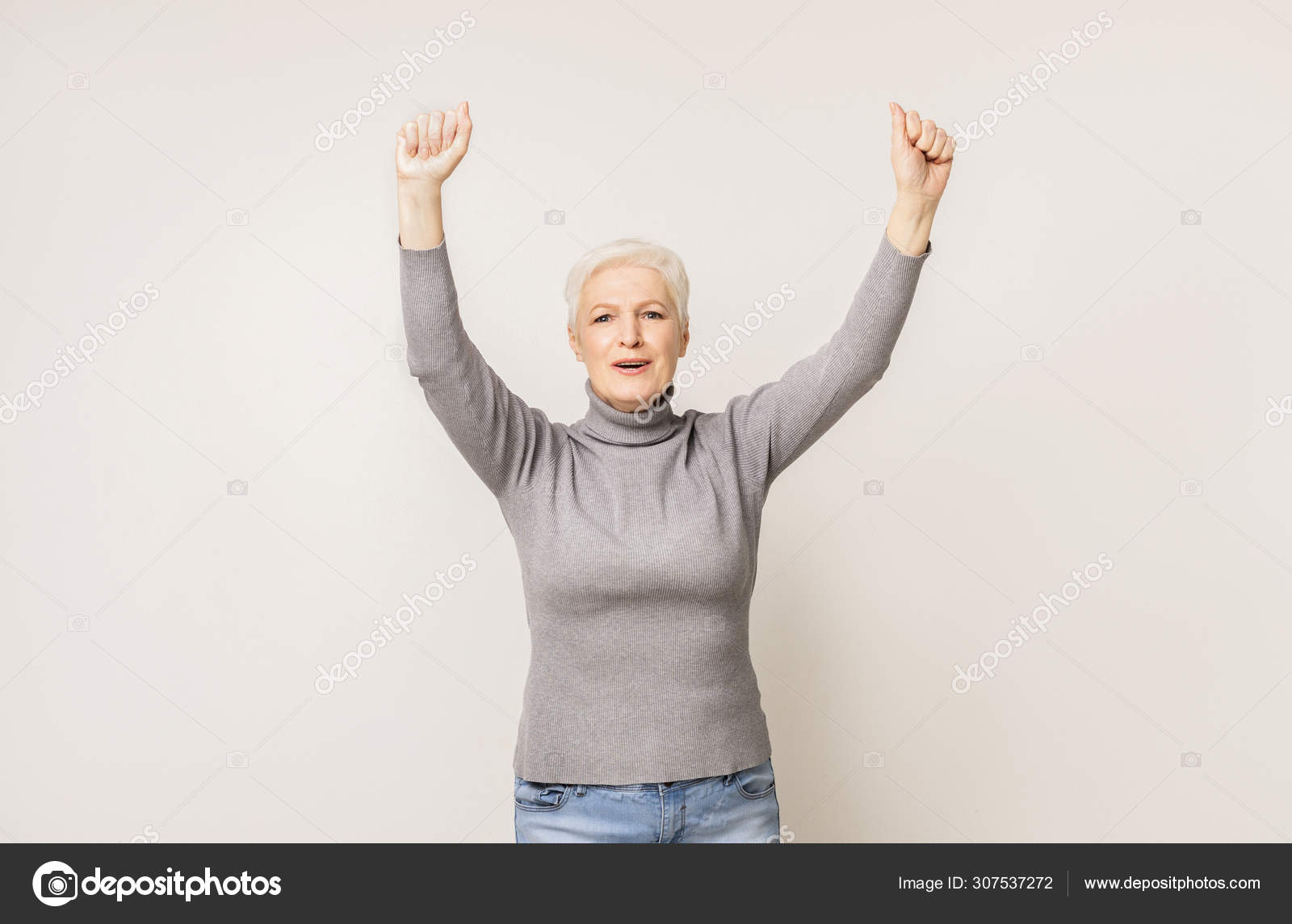 Aged woman cheering with her fists up in the air Stock Photo by ©Milkos ...