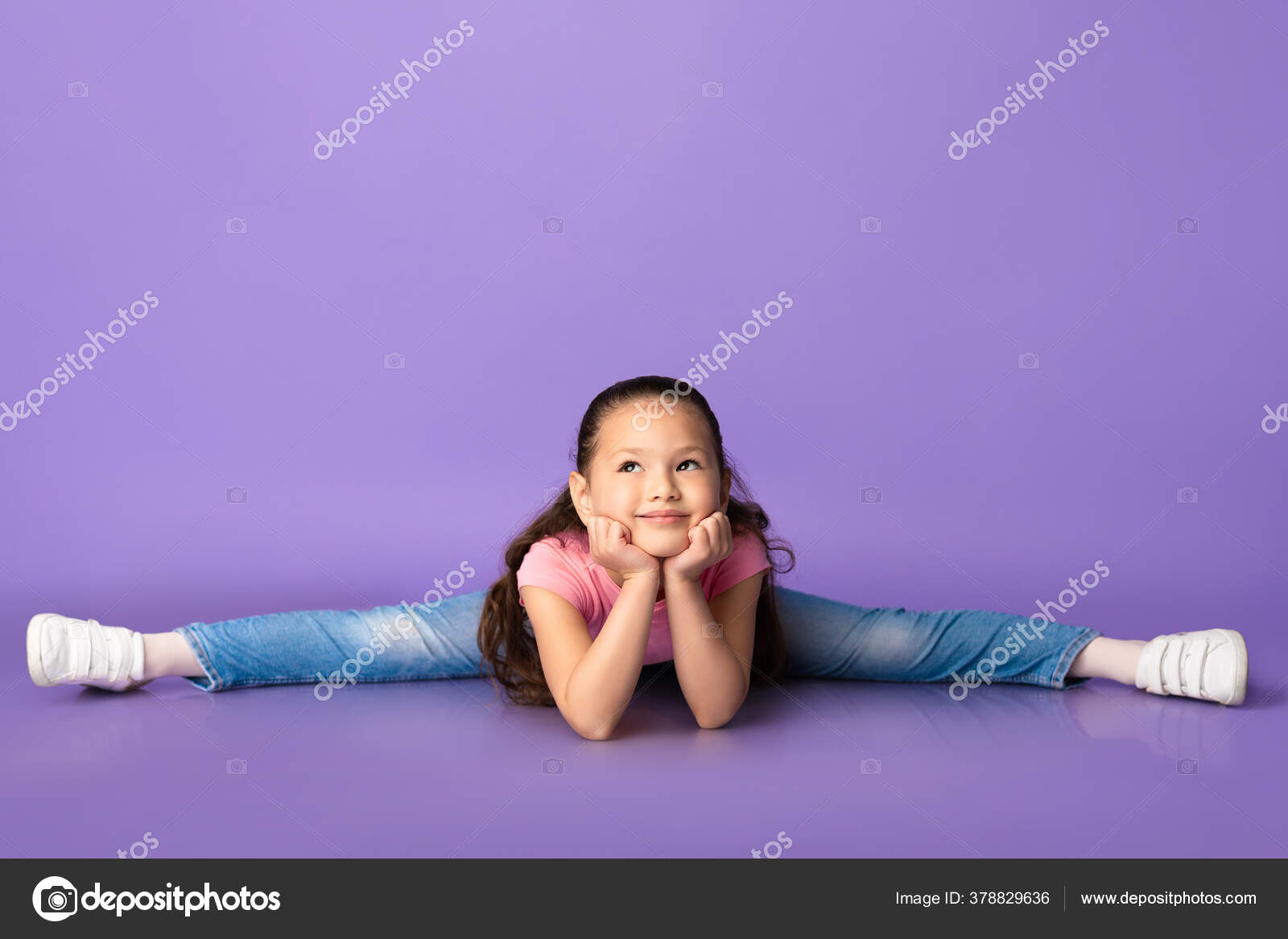 Cute little girl making splits on purple background ⬇ Stock Photo ...