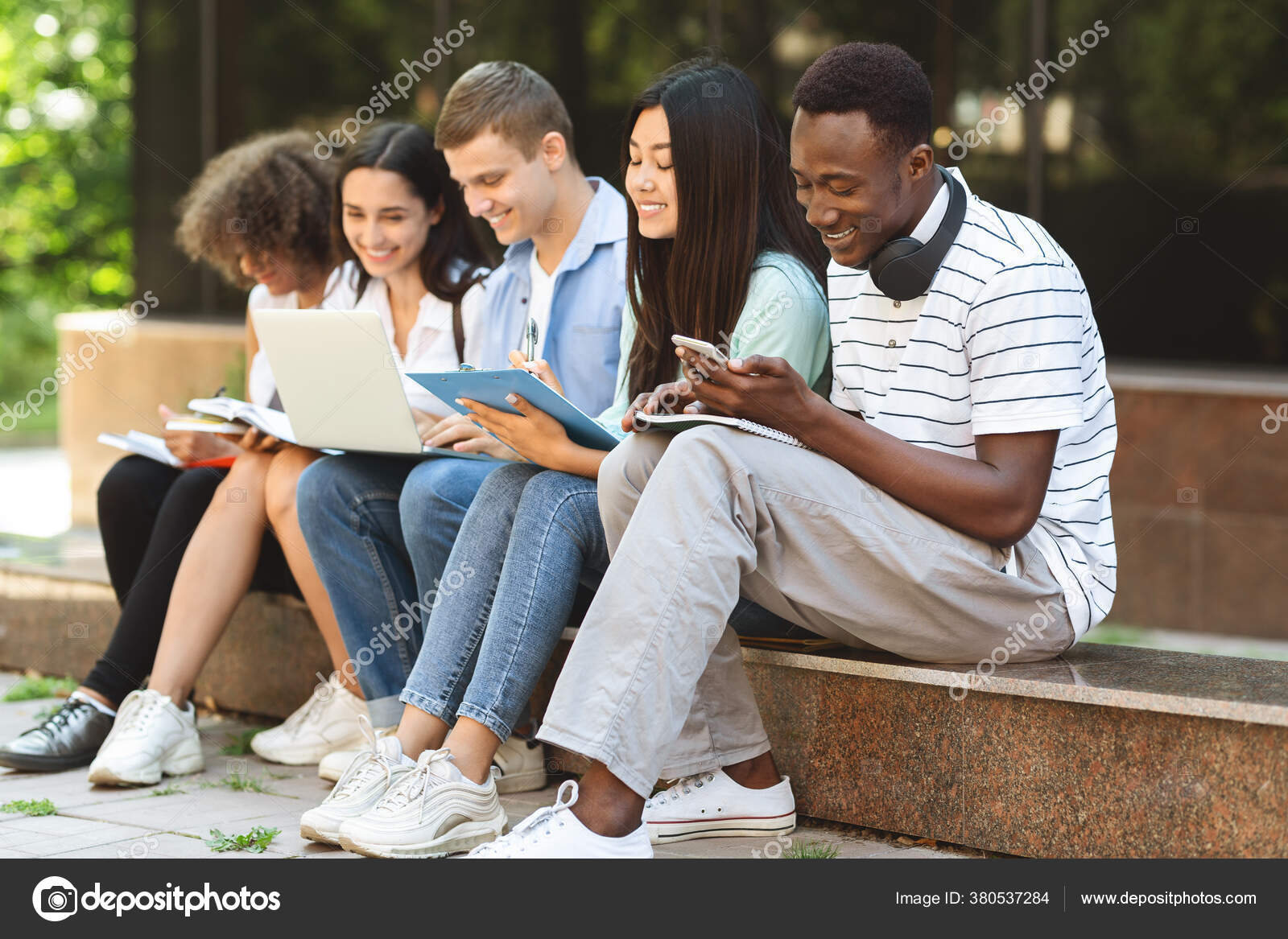 Education concept. University students preparing for exam outdoors ...