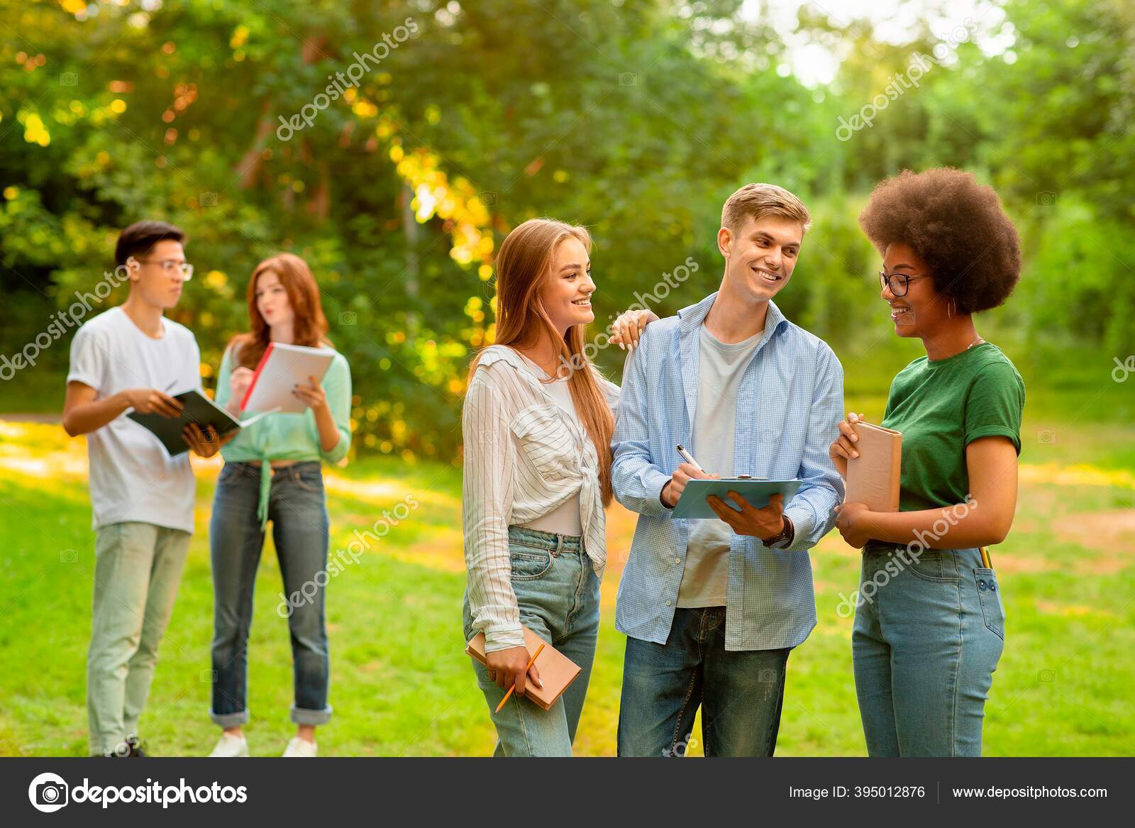 Break between classes. Group of multicultural college students resting ...