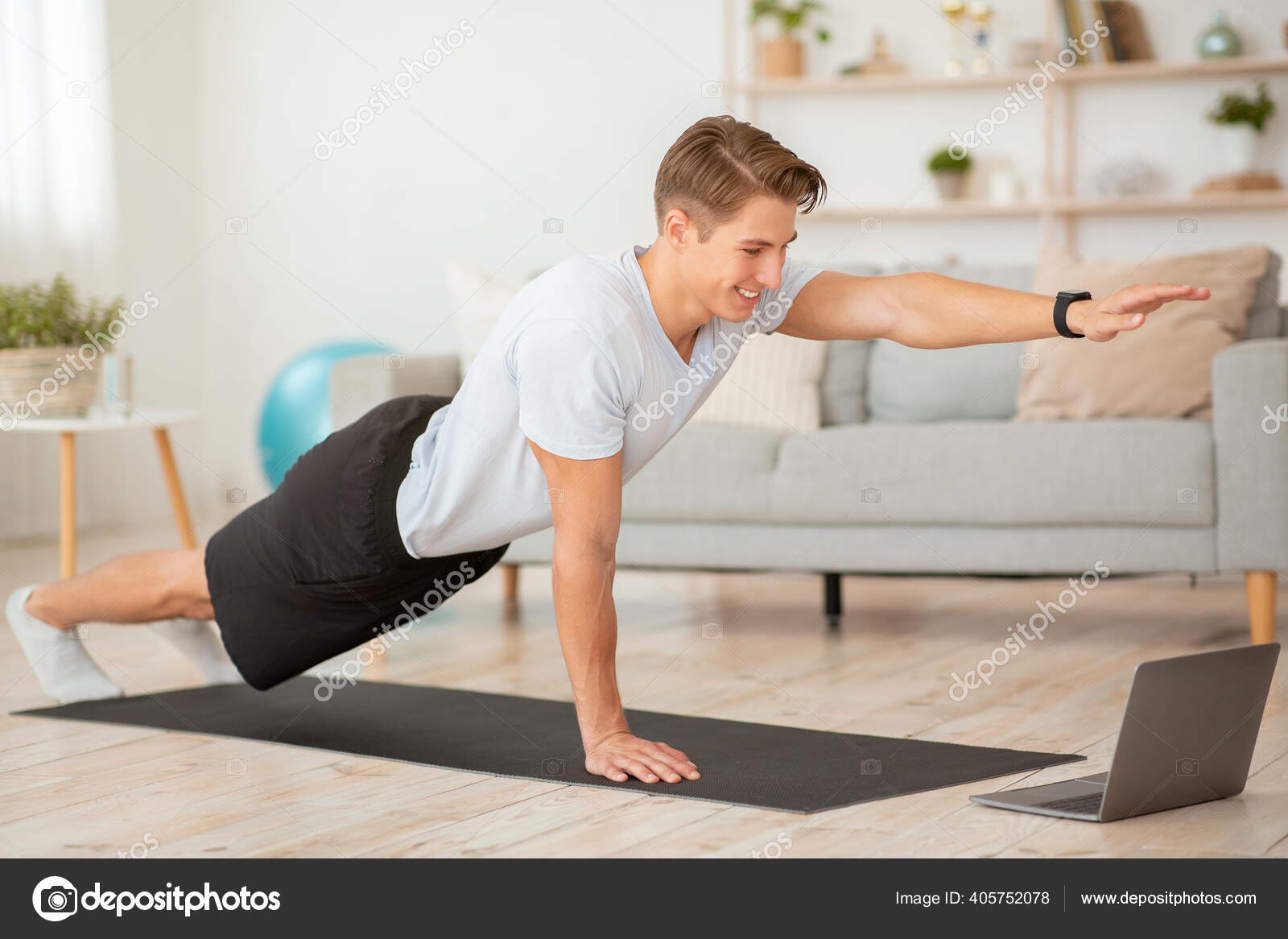 Coach remotely during quarantine. Muscular guy makes plank and looks at laptop Stock Photo by ...