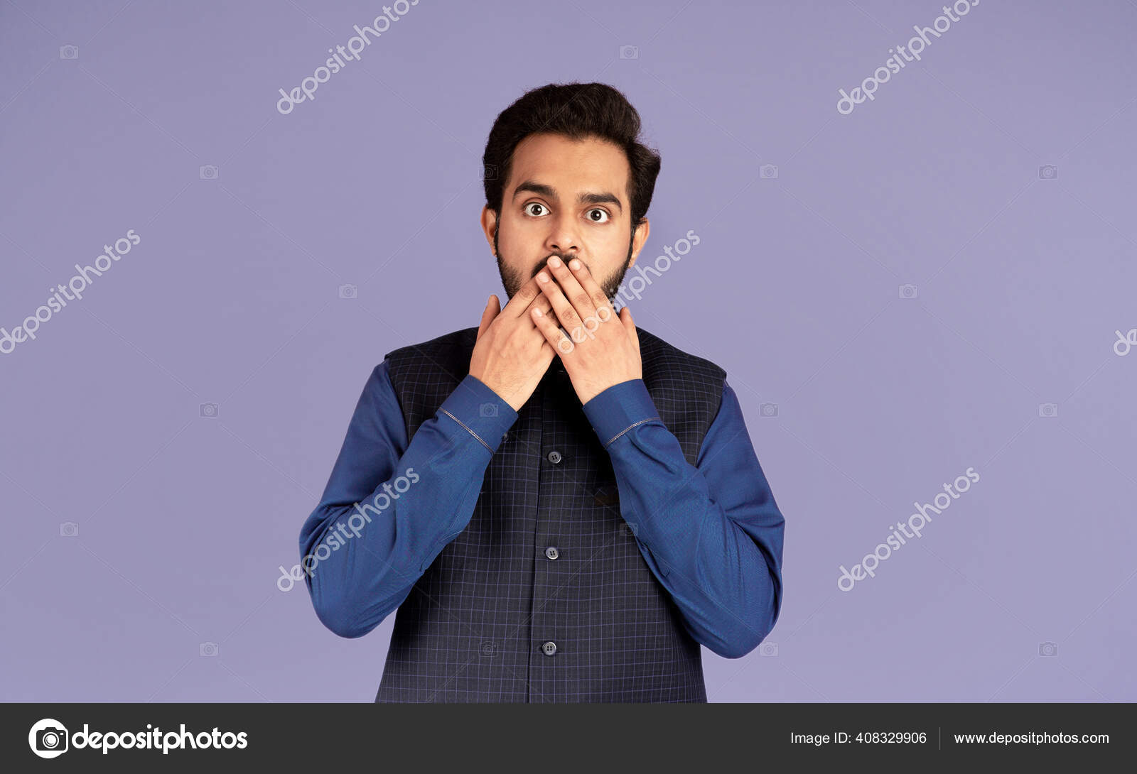 No way. Indian man covering mouth with hand in shock over violet ...