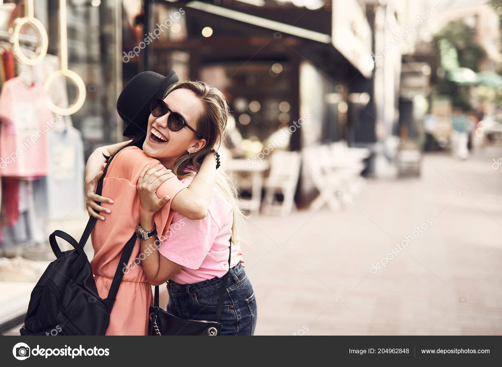 Positive women embracing each other — Stock Photo © iakovenko123 #204962848