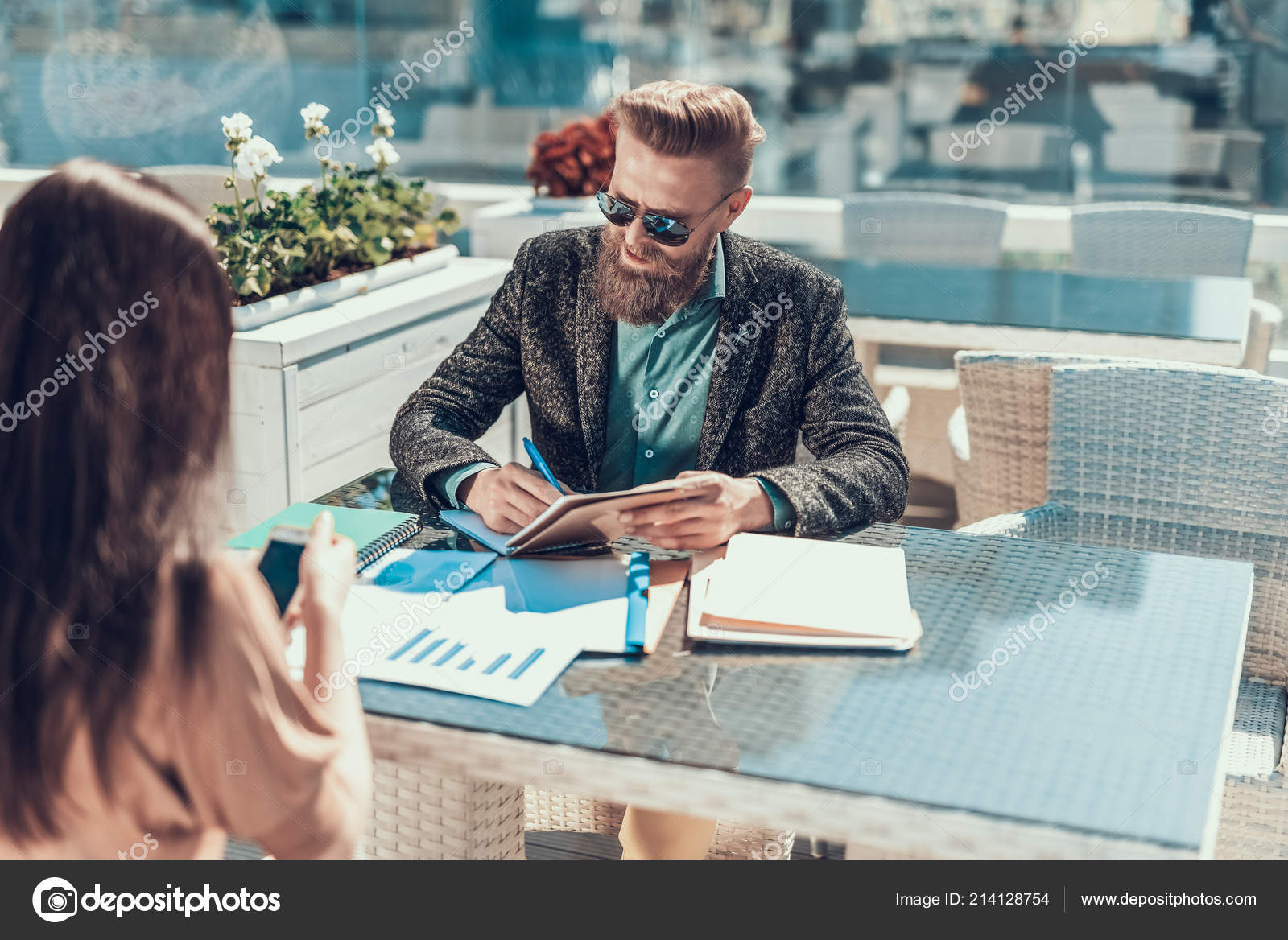 Orderly unshaven man talking with girl outdoor Stock Photo by ...