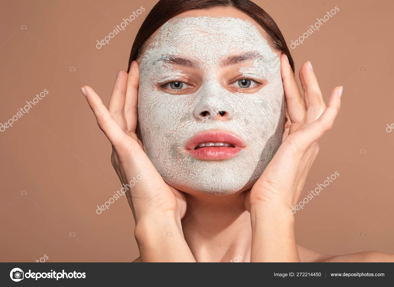 Woman pulling skin on her temples while using facial mask — Stock Photo ...