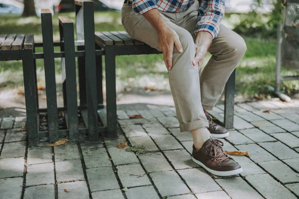 Feeling pain after twisting knee stock photo - Stock Image - Everypixel