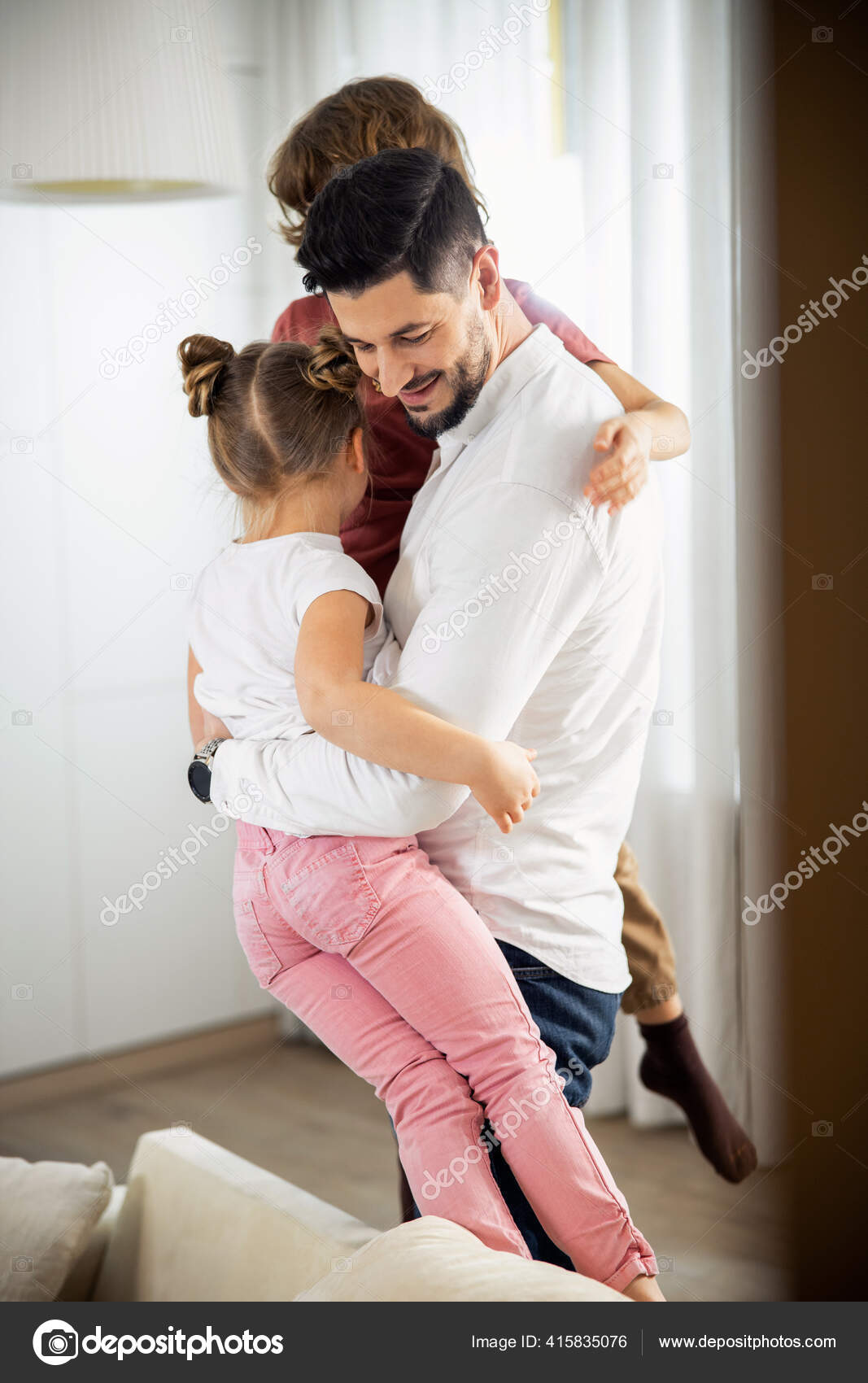 Kids hugging their father Stock Photo by ©iakovenko123 415835076