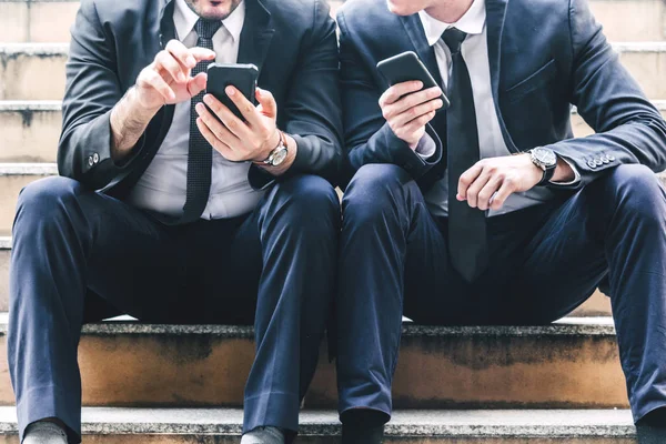Two Business People Use Technology Together Smartphone Stock Photo by ...