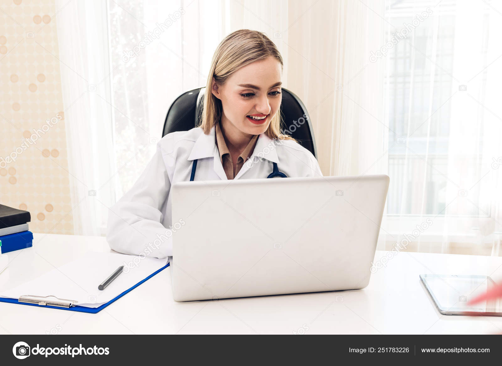 Doctor and stethoscope working with laptop computer in hospital. Stock ...