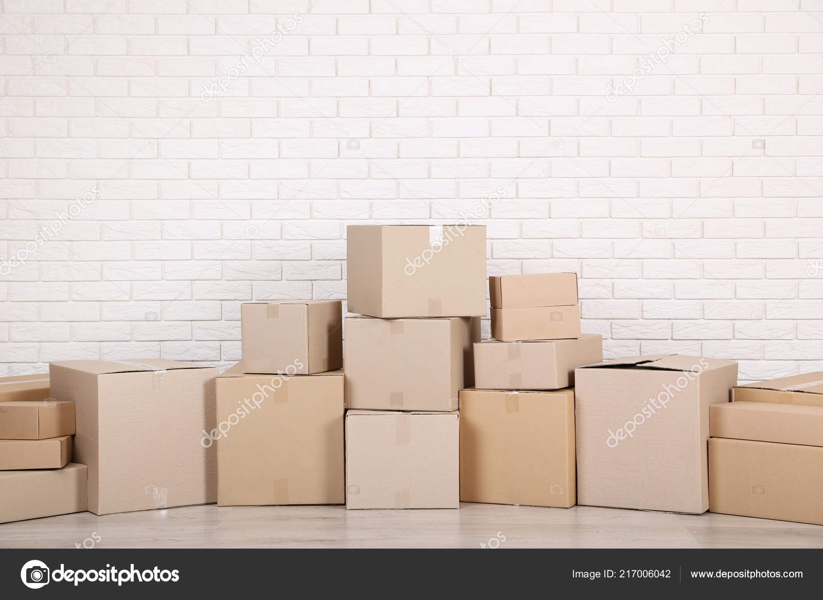 Stacked Cardboard Boxes Brick Wall Background — Stock Photo © 5seconds ...