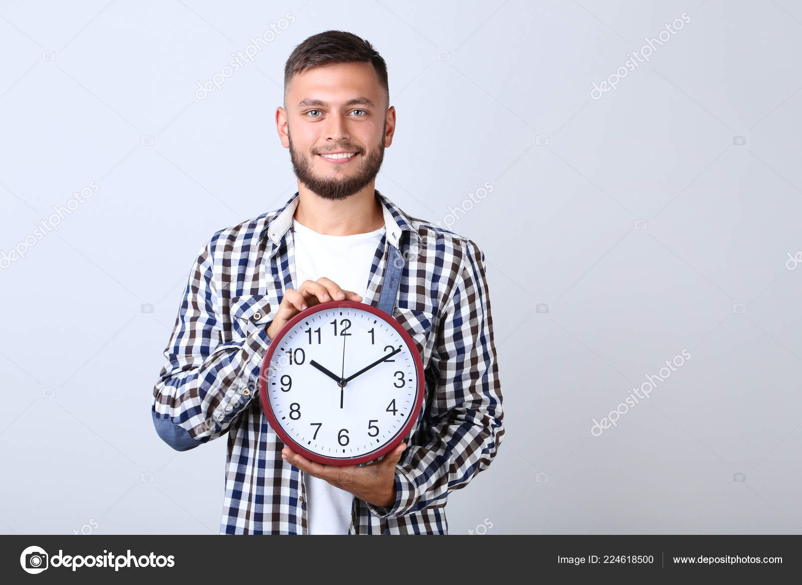 Young Man Clock Grey Background Stock Photo by ©5seconds 224618500